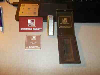 VINTAGE WIN INTERNATIONAL BUTANE LIGHTER IN PLASTIC CASE WITH PAPERWORK ...